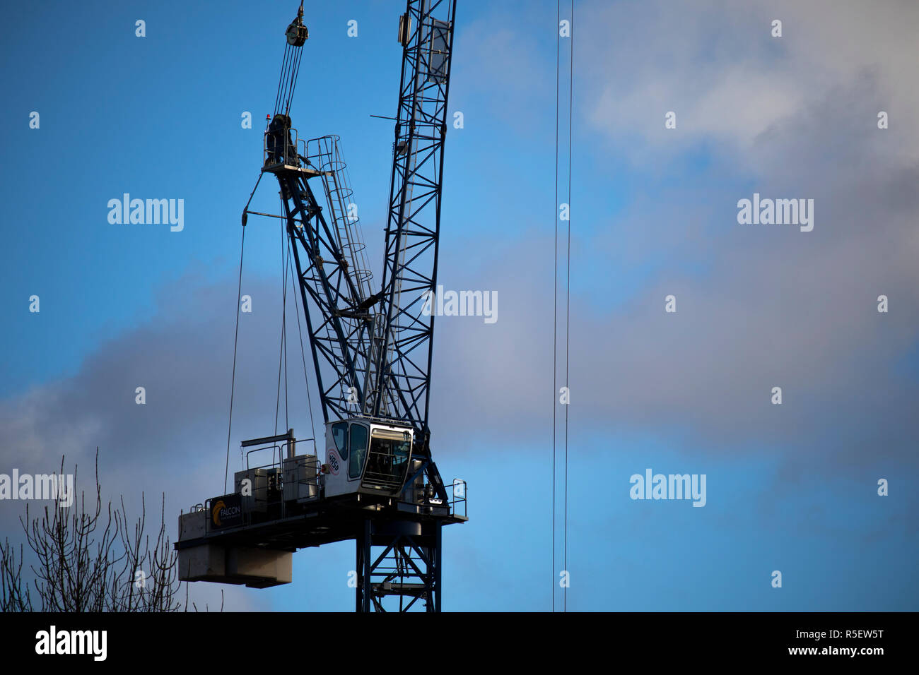 Construction site tower crane over building development Stock Photo - Alamy