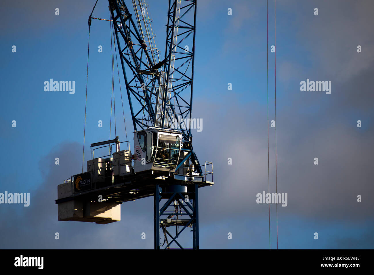 Construction site tower crane over building development Stock Photo - Alamy