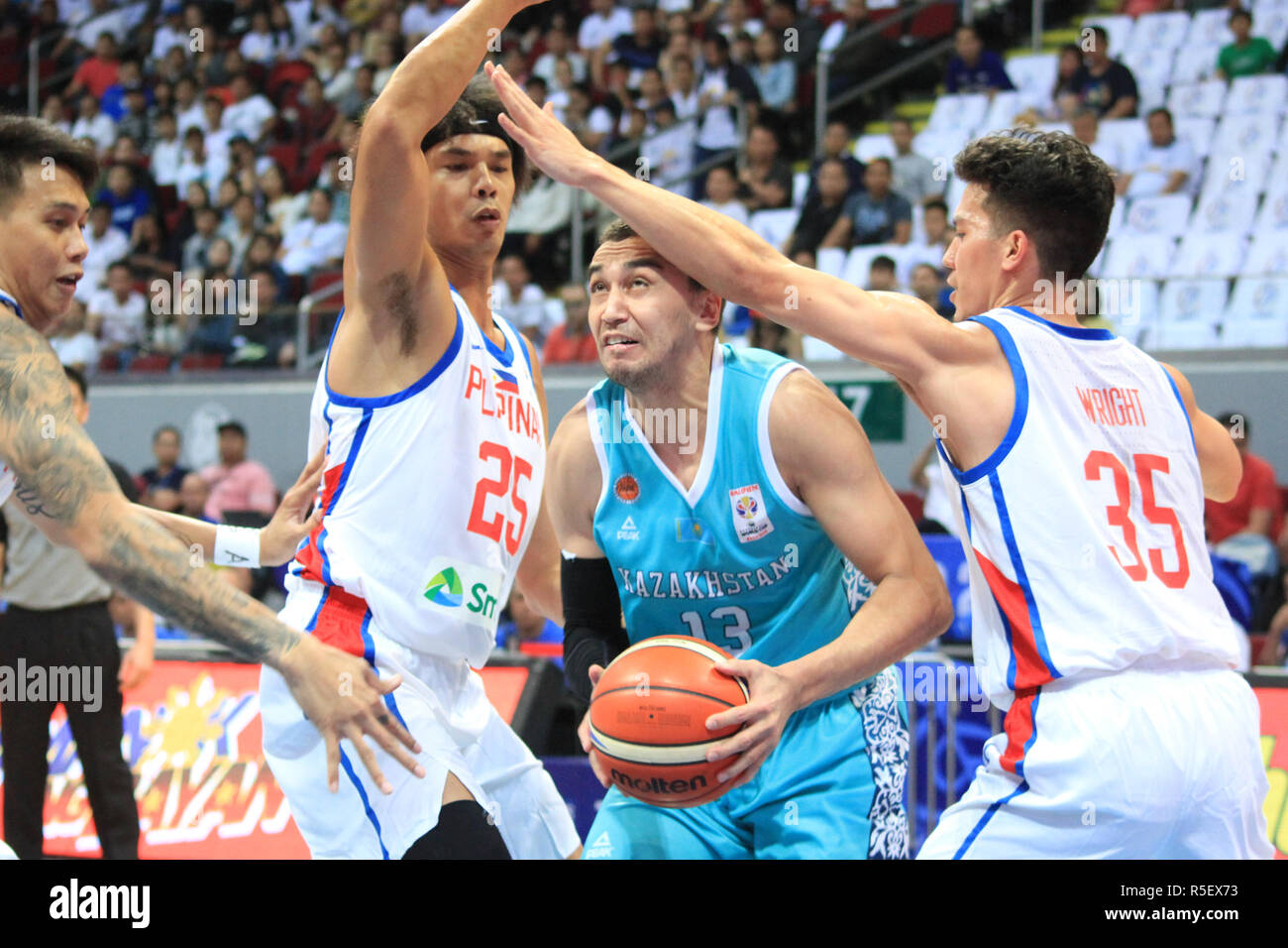 Pasay City, Philippines. 30th Nov, 2018. Rustam Yergali (13, Blue) gets ...