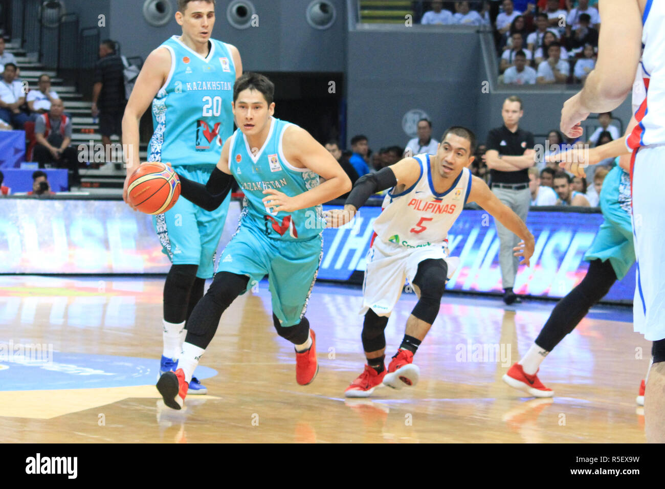 Pasay City, Philippines. 30th Nov, 2018. Shaim Kuanov (6, Blue) breaks ...