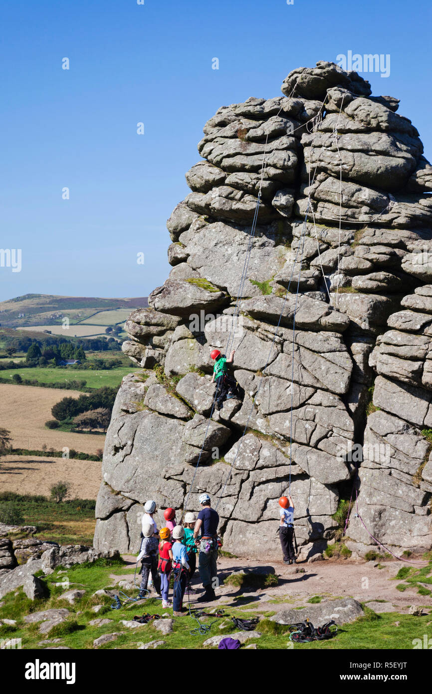 England, Devon, Dartmoor, School Children Climbing Hound Tor Stock ...