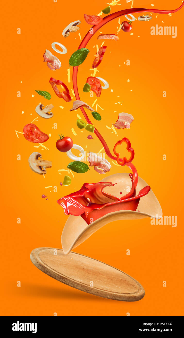Tasty pizza and falling ingredients on orange background Stock Photo ...