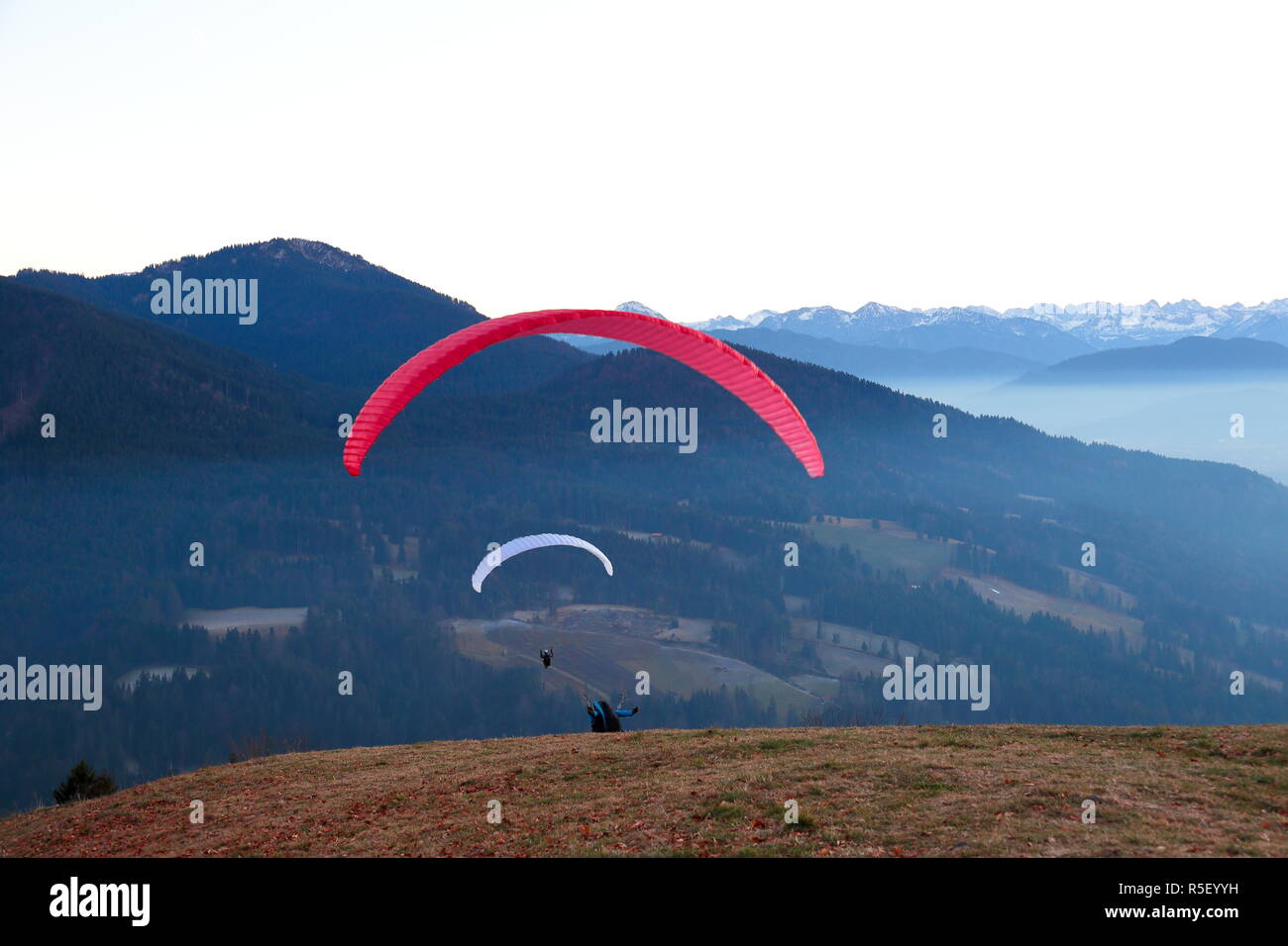 two starting paragliders Stock Photo - Alamy