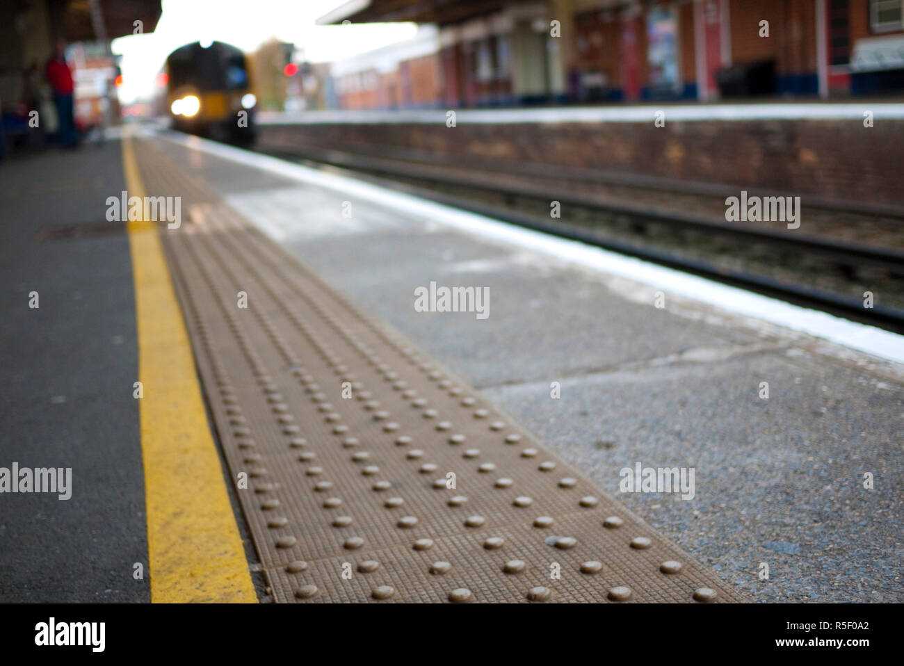 Train approaching platform Stock Photo - Alamy