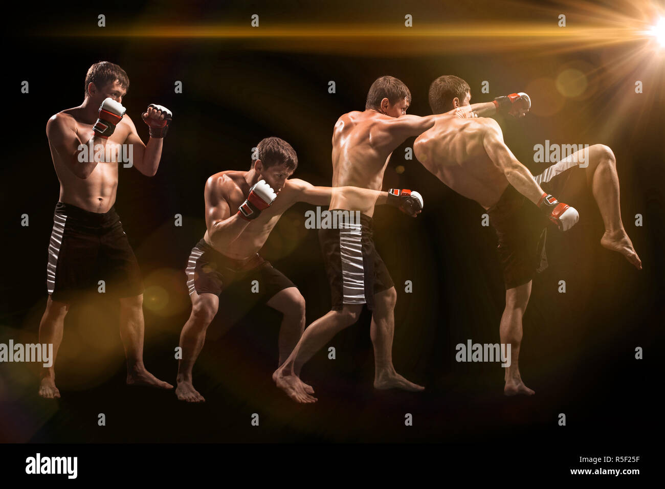 Male boxer boxing in punching bag with dramatic edgy lighting in a dark ...