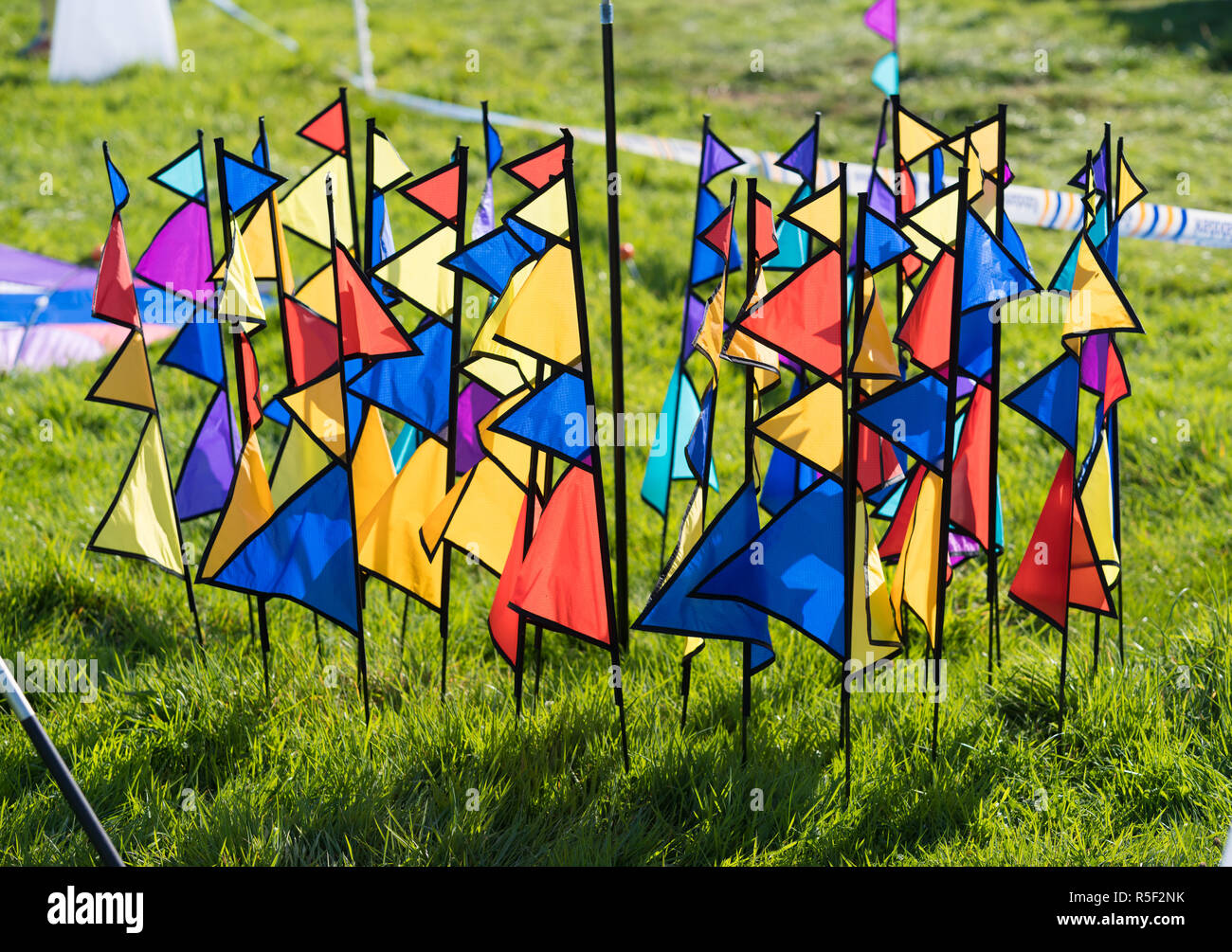 colorful flags in the ground Stock Photo - Alamy