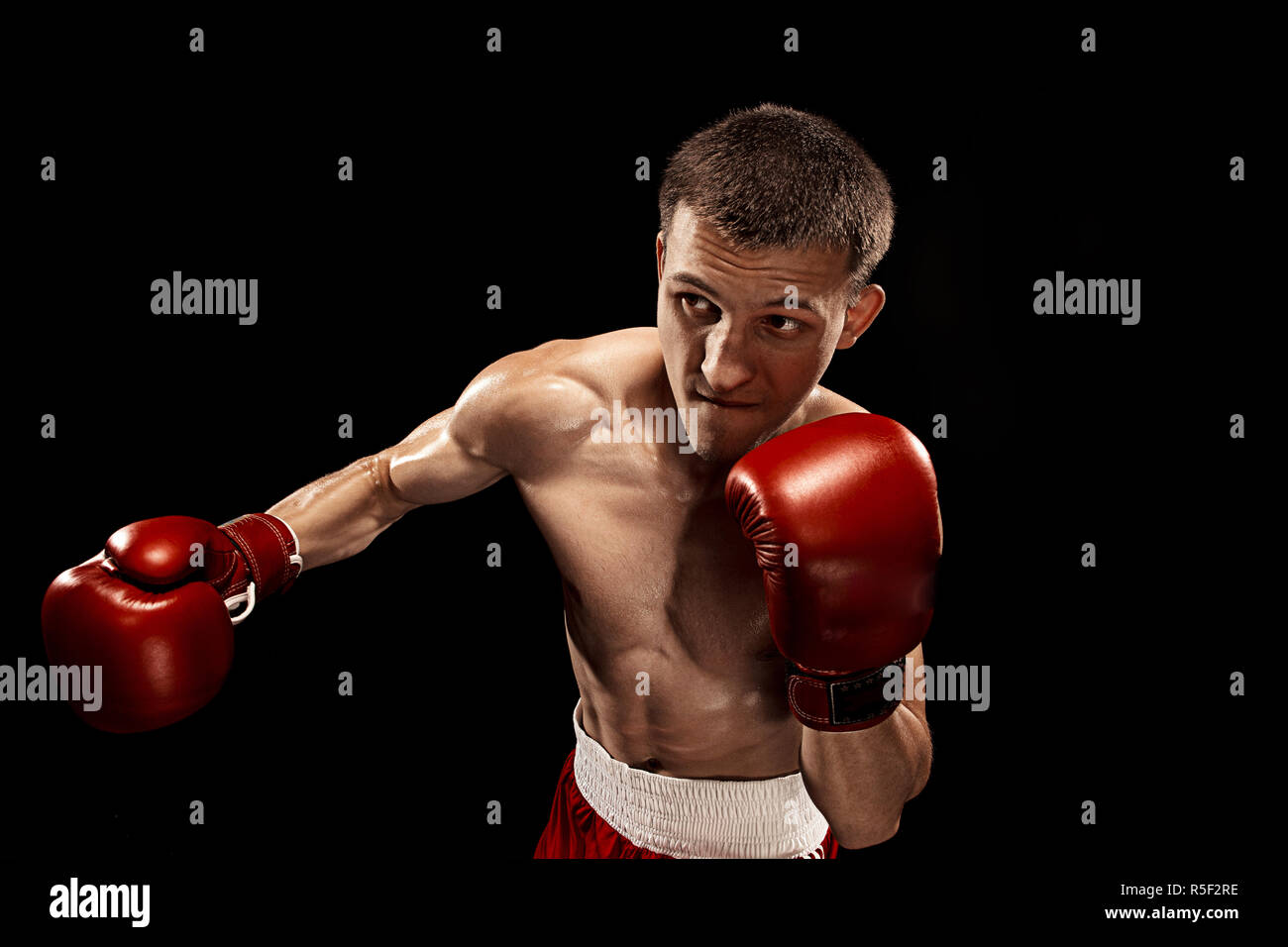 Male boxer boxing with dramatic edgy lighting in a dark studio Stock ...