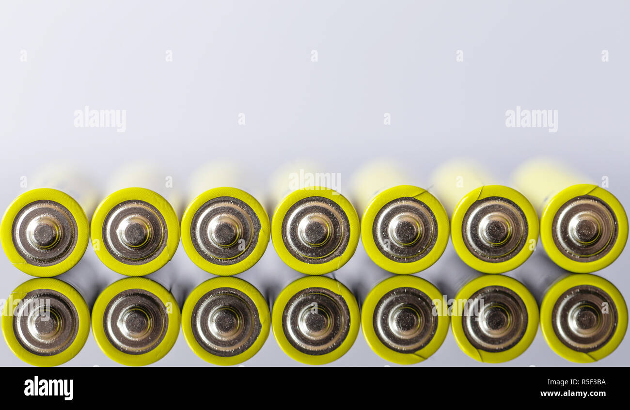 Energy Blured Abstract Background Of Yellow Color Batteries. Mirror ...