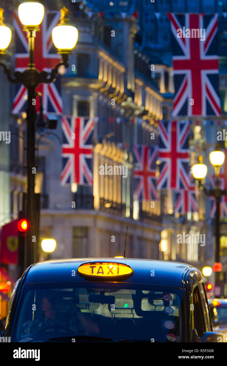 UK, England, London, Regent Street, Taxis and Union Jack Flags Stock ...