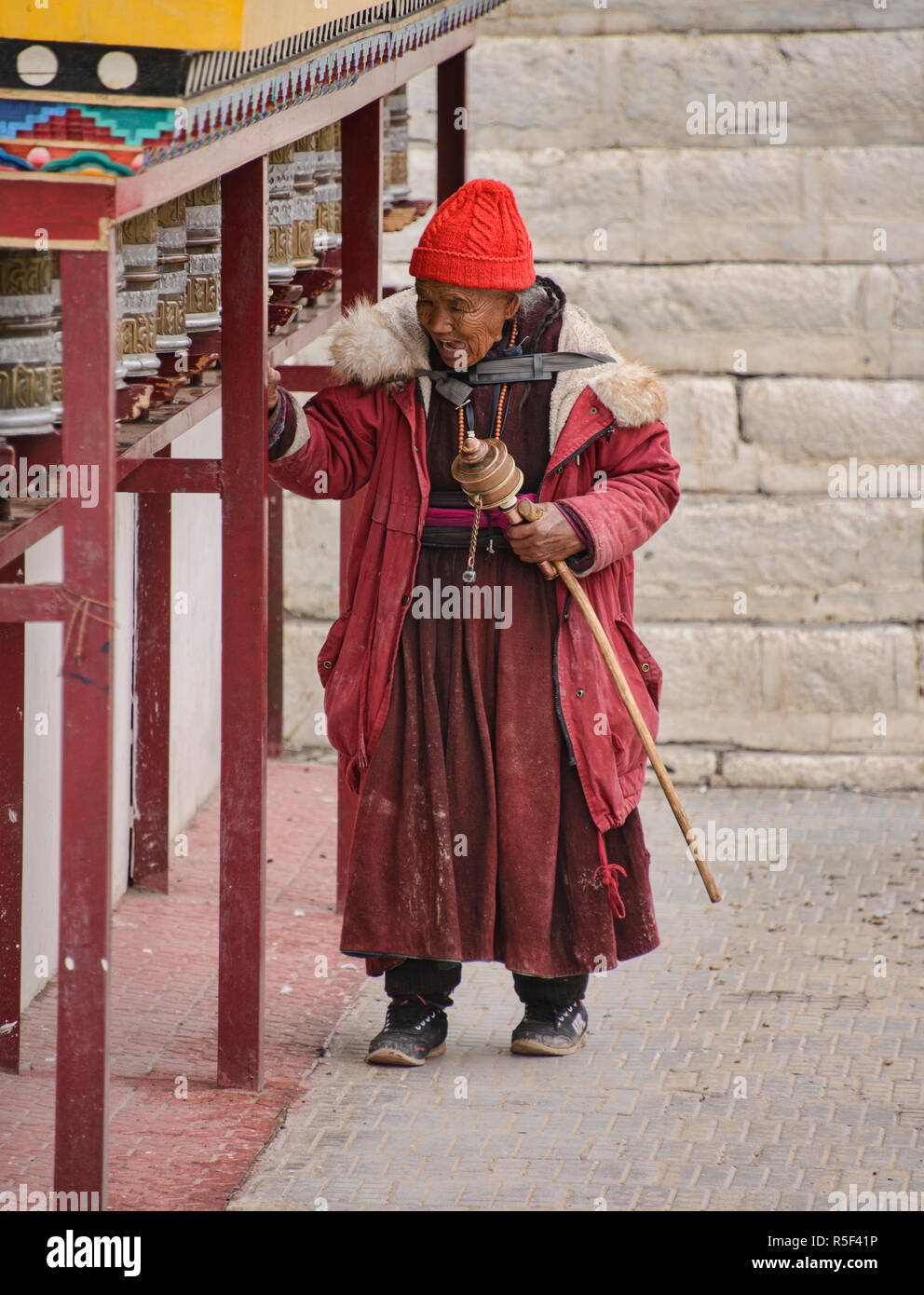 Ladakhi pilgrim spinning prayer wheels, Leh, Ladakh, India Stock Photo ...