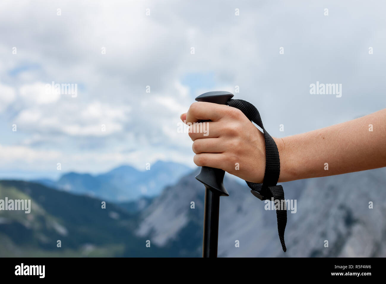 female hand keeping hiking stick Stock Photo - Alamy