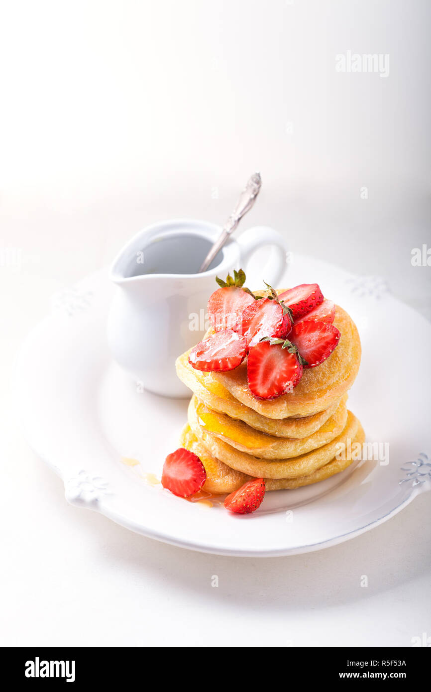 Stack of sweet pancakes with strawberry and honey Stock Photo - Alamy