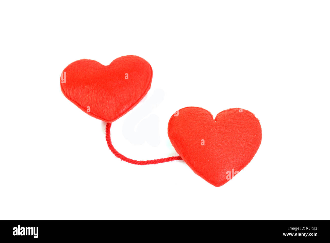 Two red hearts in love Stock Photo - Alamy