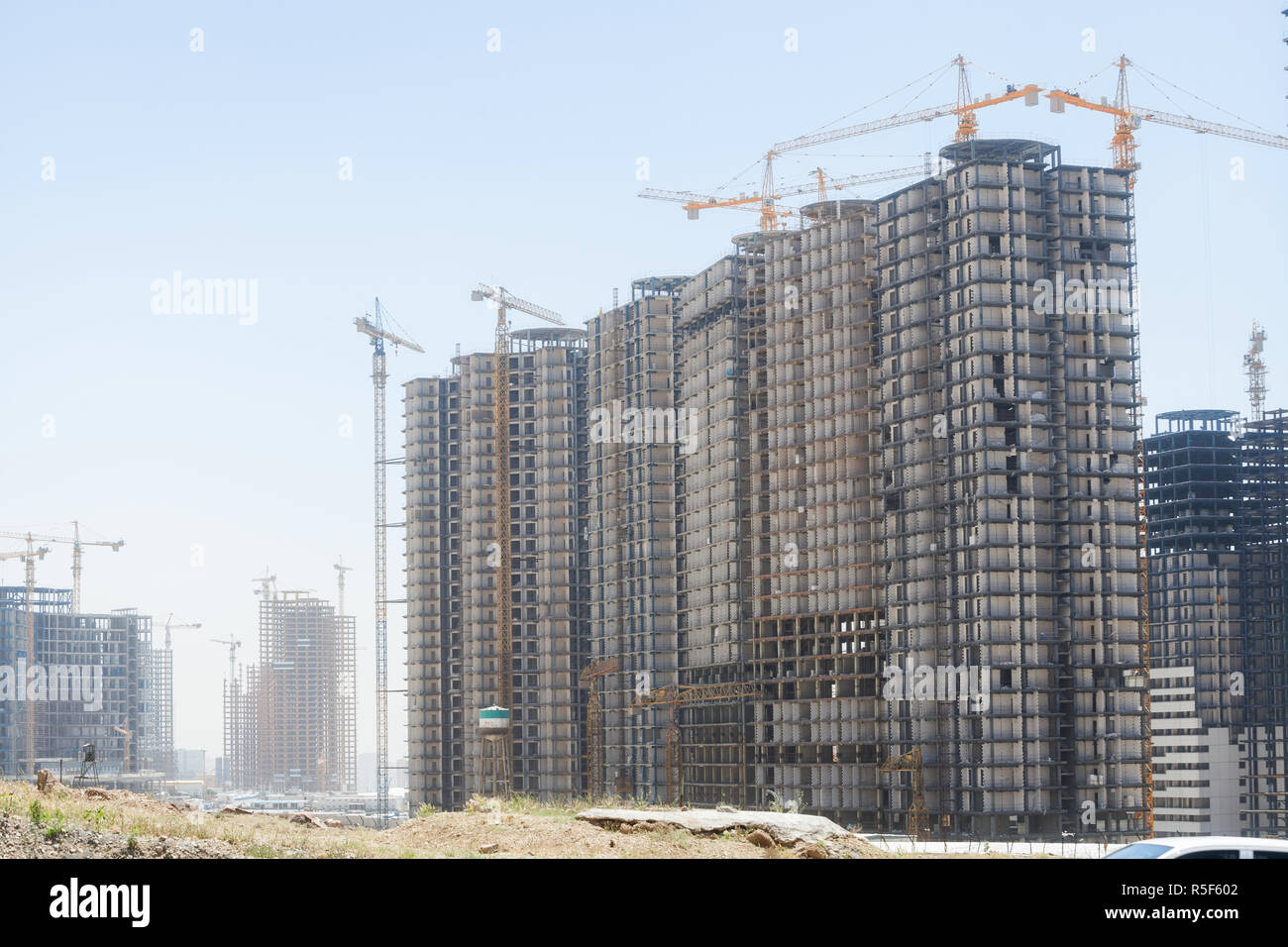 Cranes building a block Stock Photo - Alamy