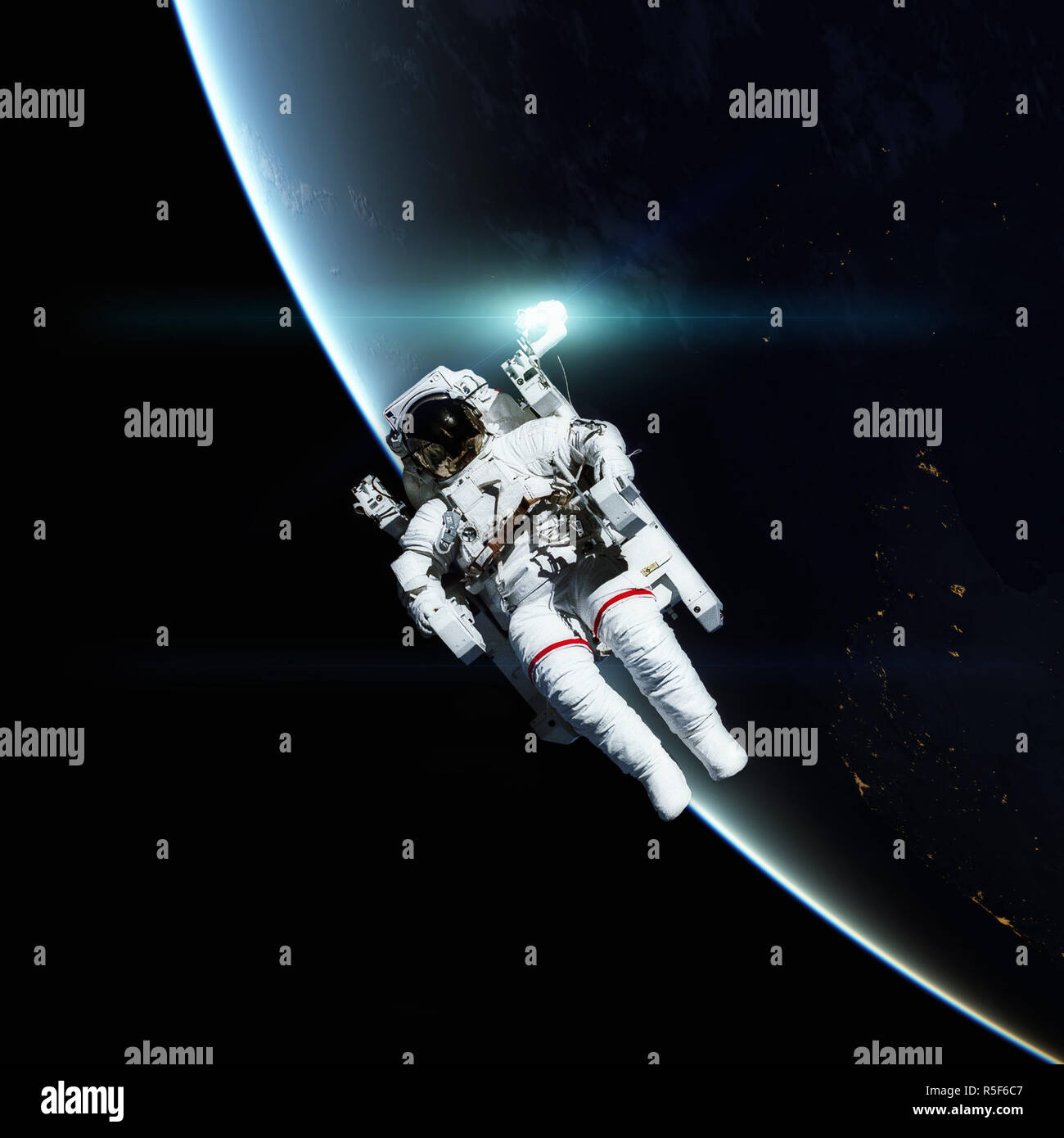 Astronaut in outer space. Planet Earth on the background Stock Photo ...