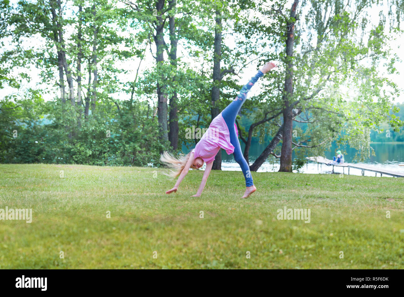 Little girl turning hi-res stock photography and images - Alamy