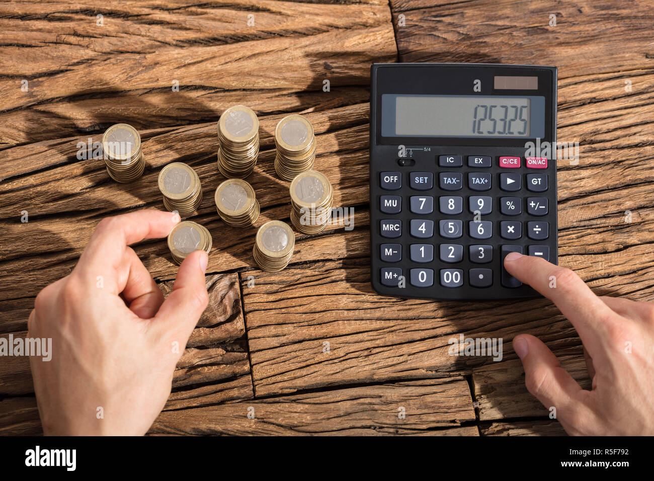 Man placing coin on table hi-res stock photography and images - Alamy