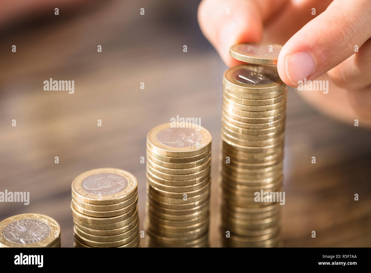 Businessman holding gold bar hi-res stock photography and images - Alamy