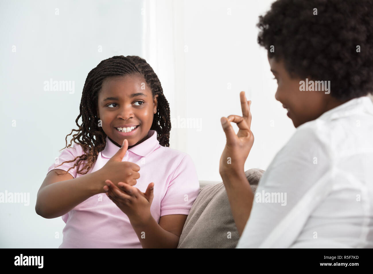 Deaf Mother Talking Sign Language With Her Daughter Stock Photo - Alamy