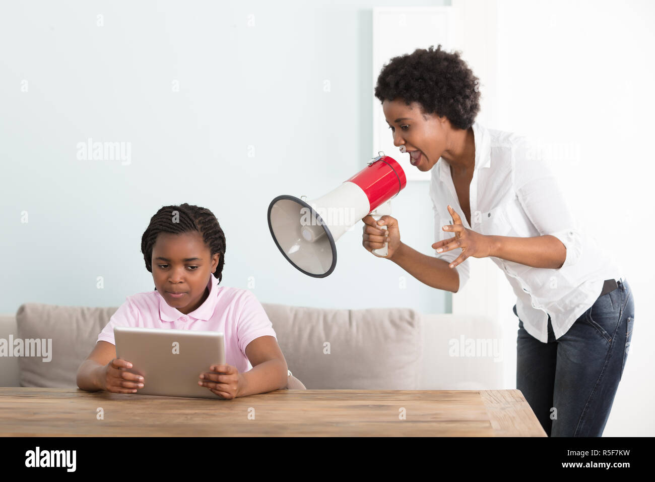 Child megaphone parent hi-res stock photography and images - Alamy