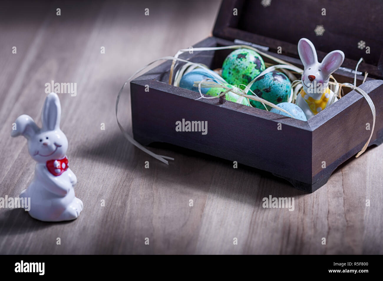 Easter bunny with colorful eggs in a box Stock Photo - Alamy