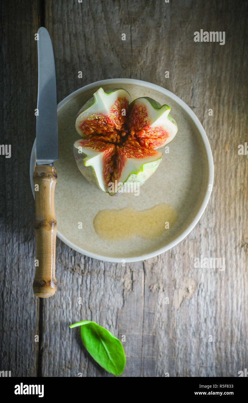 Fresh Juicy fig with a knife Stock Photo - Alamy