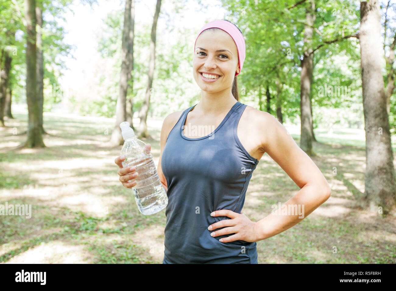Fit sporty smiling woman Stock Photo - Alamy