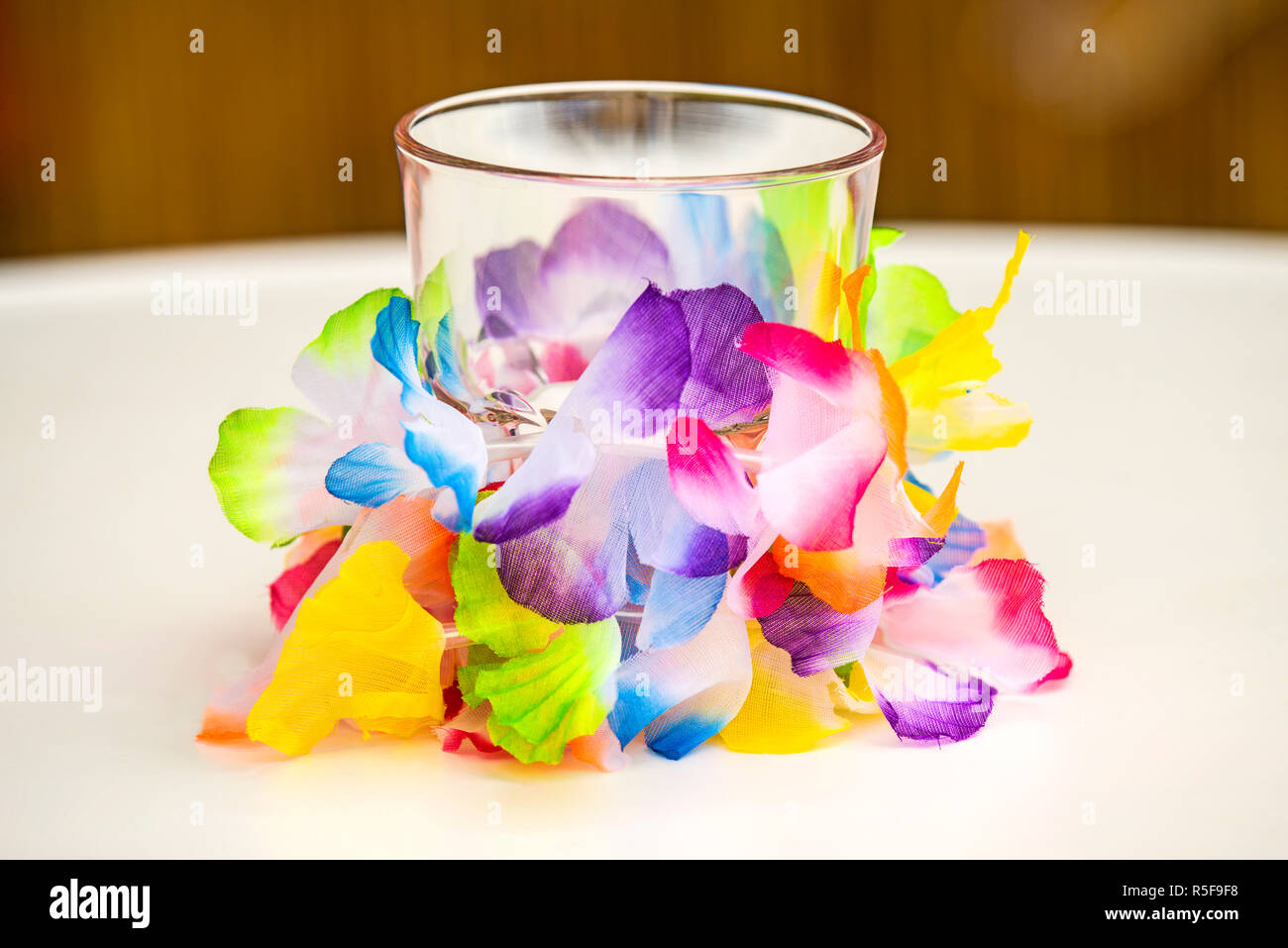 pretty glass decorated with colorful crepe paper Stock Photo - Alamy