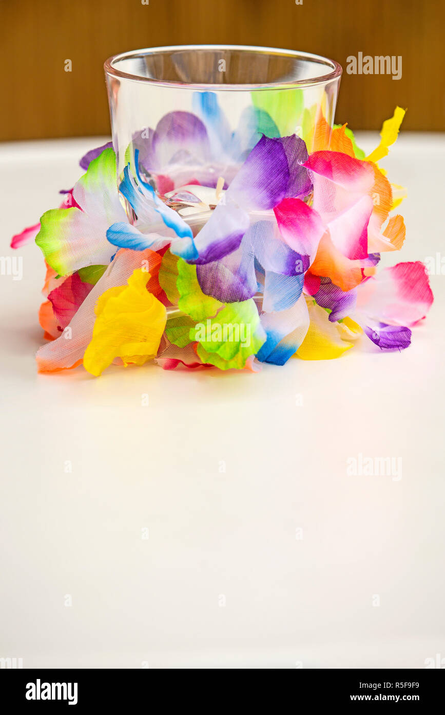 pretty glass decorated with colorful crepe paper Stock Photo - Alamy