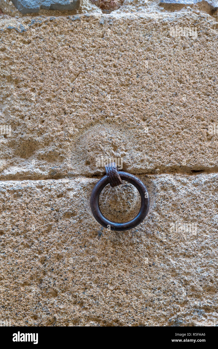 iron hoop hanging from stone wall Stock Photo - Alamy