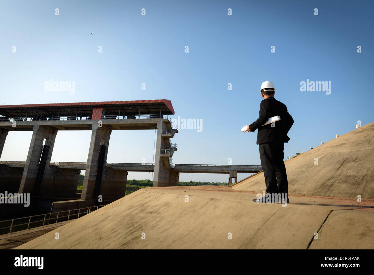 Successful man with a young engineer is watching the project Stock ...