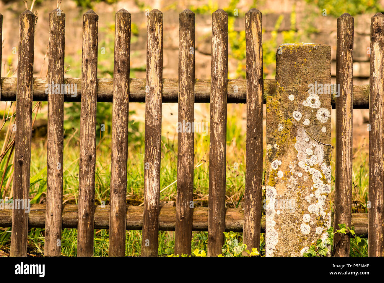 old fence in front of castle wall Stock Photo - Alamy