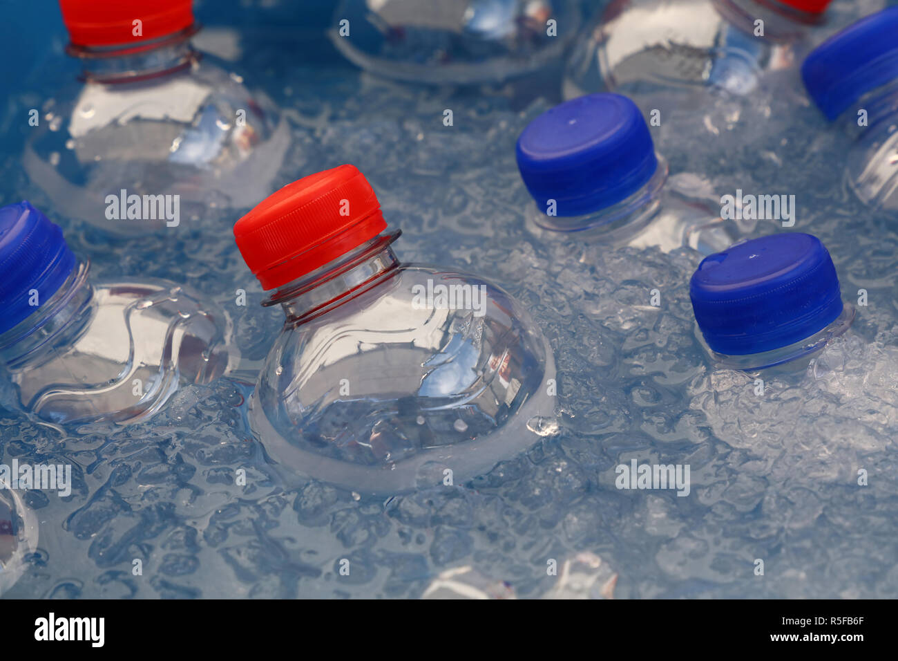 PET plastic bottles of cold drinking water in ice Stock Photo - Alamy