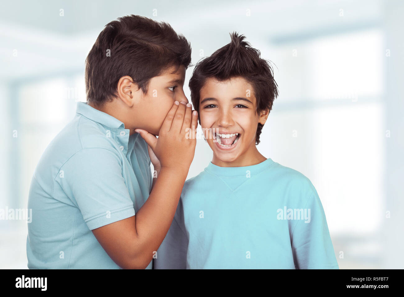 Two happy boys gossiping Stock Photo - Alamy