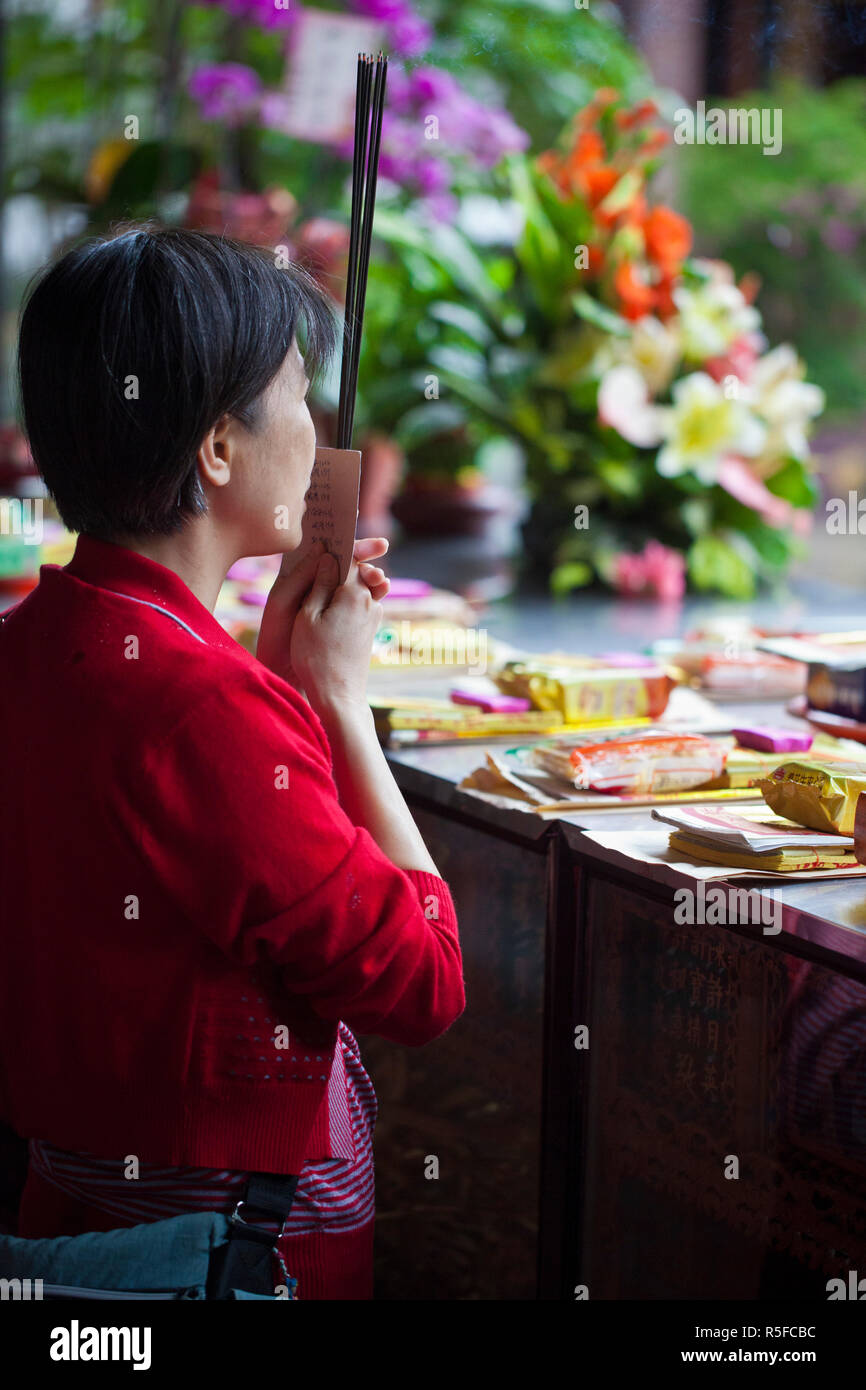 Taiwan, Taipei, Woman praying at Bao-an Temple Stock Photo - Alamy