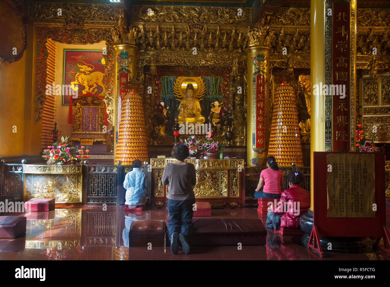 Taiwan, Kaohsiung, Lotus pond, People praying inside Temple of ...
