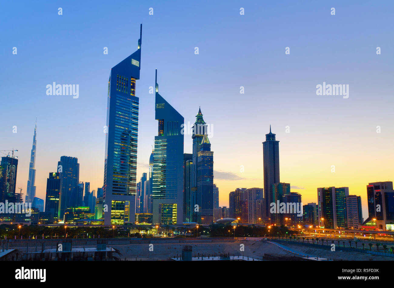 UAE, Dubai, Sheikh Zayed Road, Emirates Towers in centre Stock Photo ...