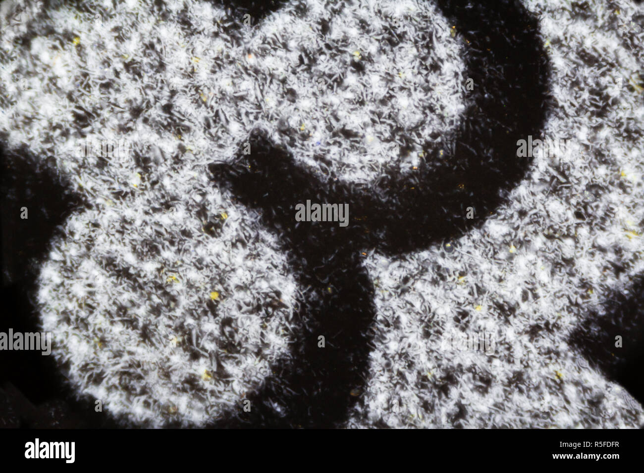 Embedded digit 3 on sim card under the microscope Stock Photo - Alamy