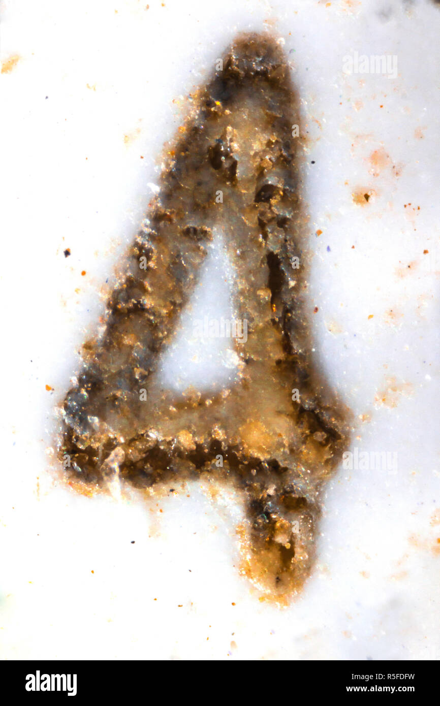 Embedded digit 4 on sim card under the microscope Stock Photo - Alamy