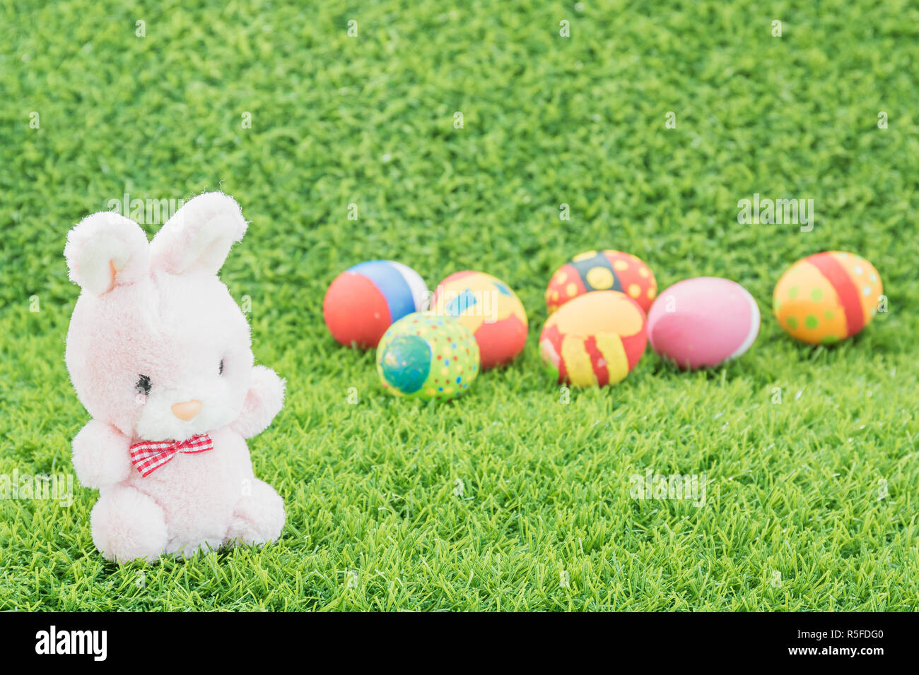 Easter bunny toy and Easter eggs Stock Photo - Alamy