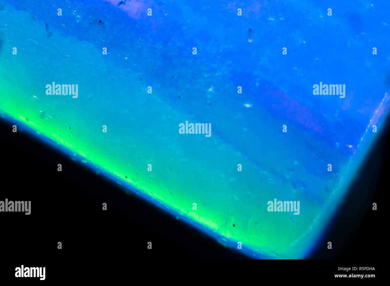 Blue gem under the microscope Stock Photo - Alamy