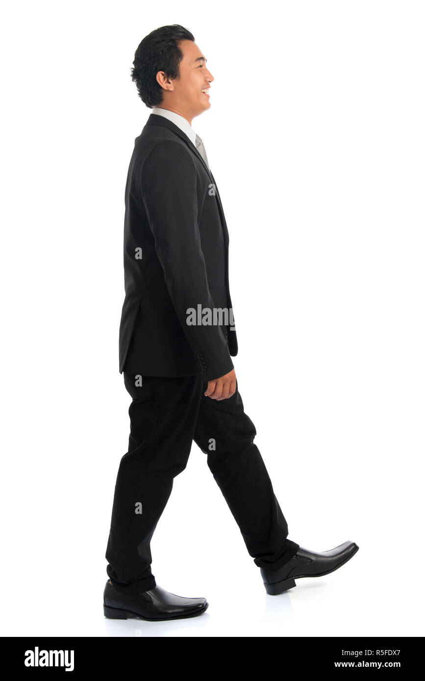 Man walking side view office Cut Out Stock Images & Pictures - Alamy