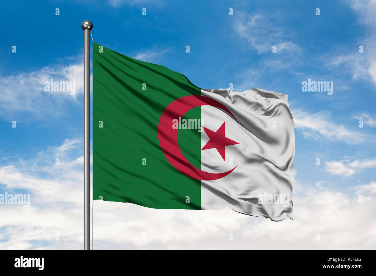 Flag of Algeria waving in the wind against white cloudy blue sky Stock ...