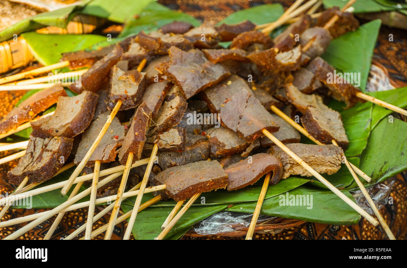 satay sate skin cow with brown color and banana leaf to serve from ...