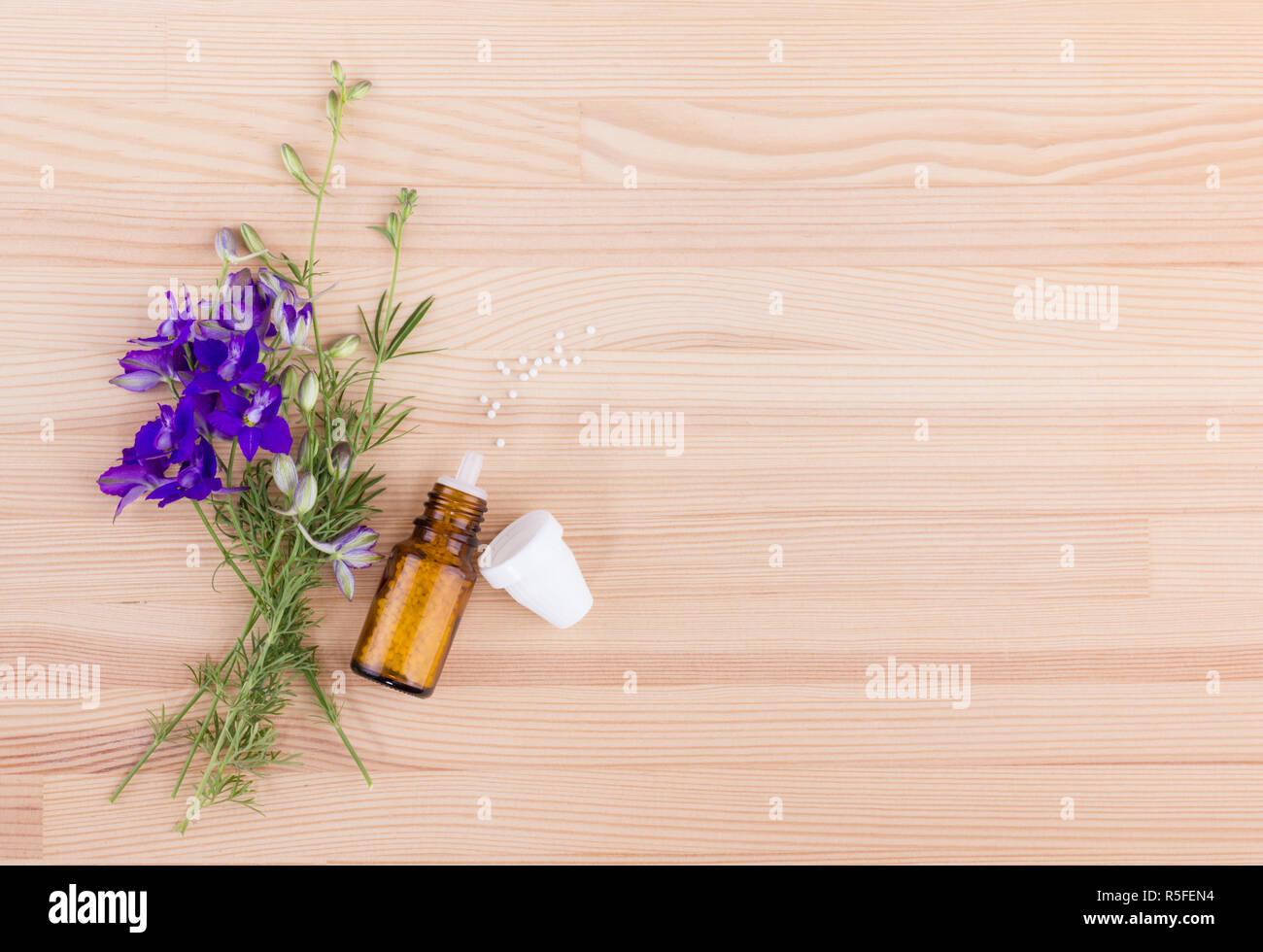 Homeopathic remedy with blooming aconite Stock Photo - Alamy