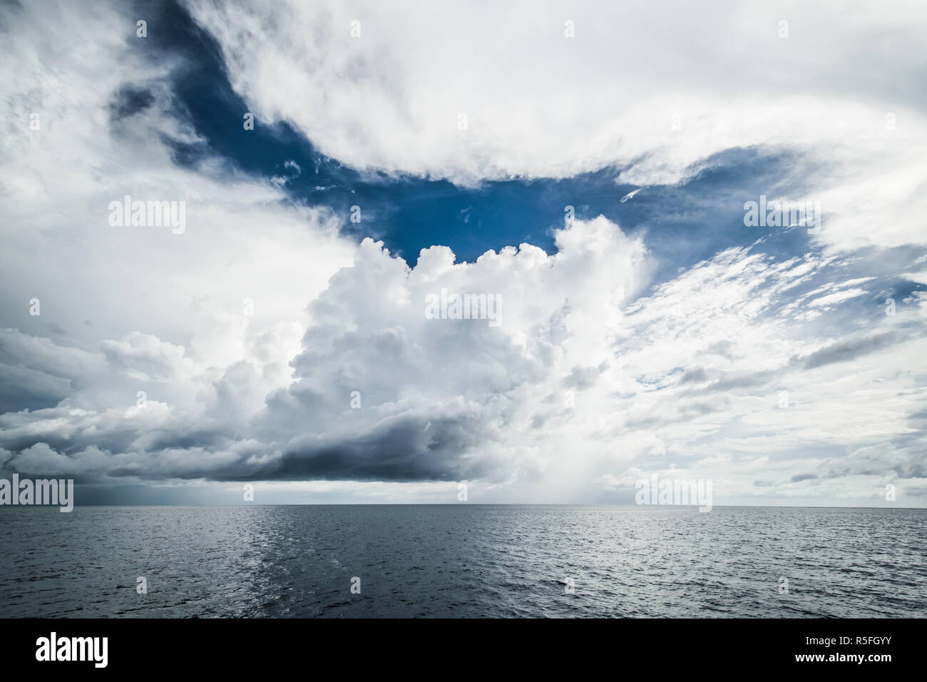 Dark clouds in open ocean Stock Photo - Alamy