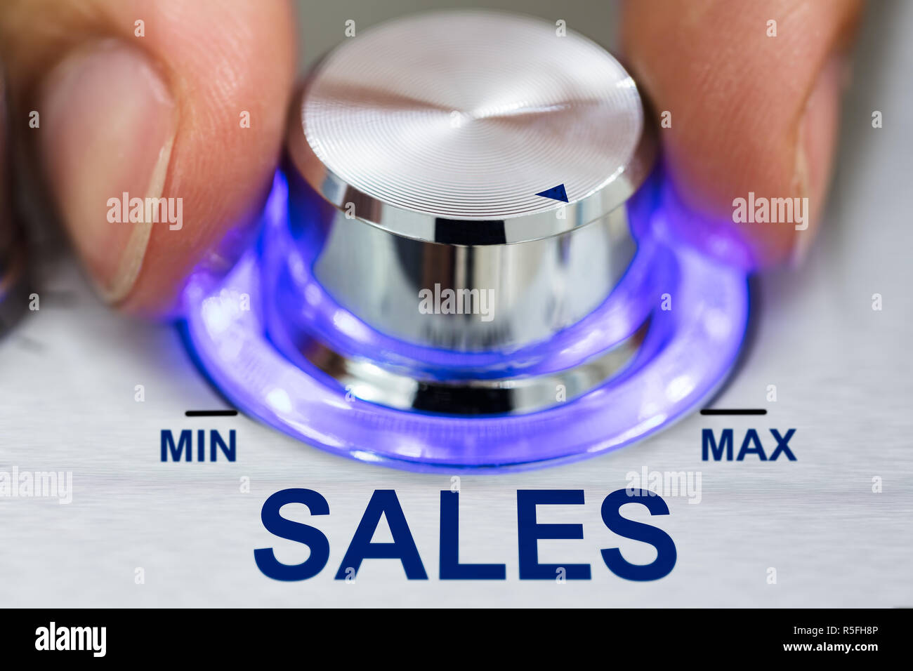 Hand Turning Knob By Sales Text Stock Photo - Alamy