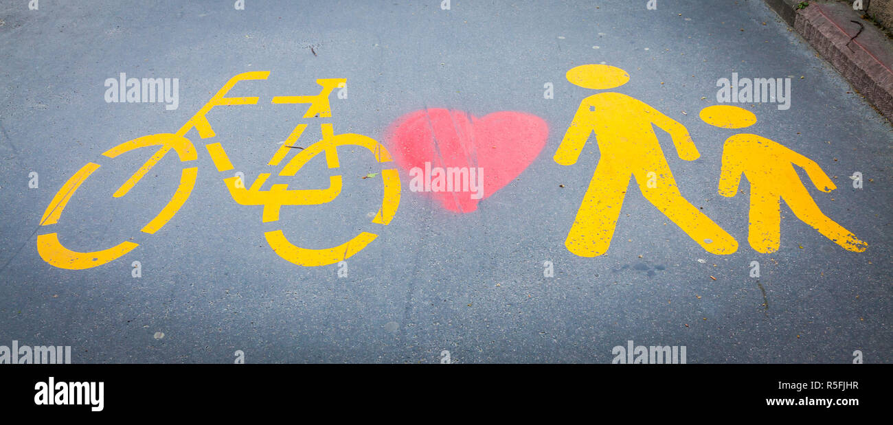 Bicycle signs painted on asphalt Stock Photo - Alamy