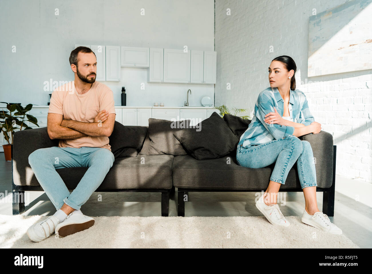 Family opposite ends of room hi-res stock photography and images - Alamy