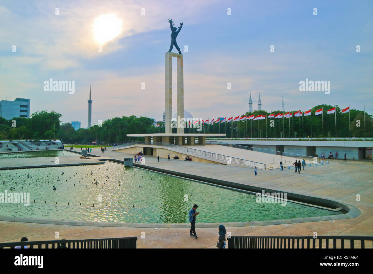 A freedom statue at Lapangan Banteng on sunset moment Stock Photo - Alamy